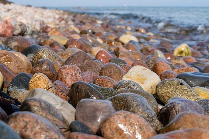 A Pebble Beach with Lots of Different Rocks in it Stock Image - Image ...