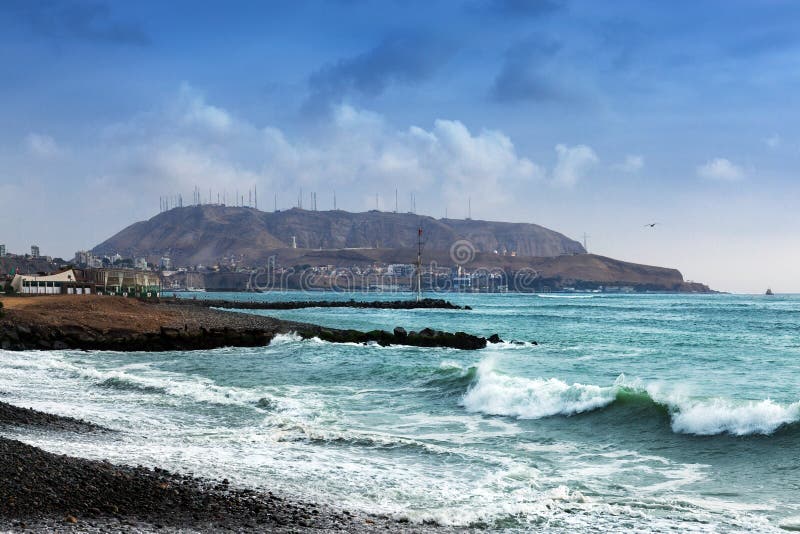 Pebble beach ocean stock photo. Image of color, pier - 116385828