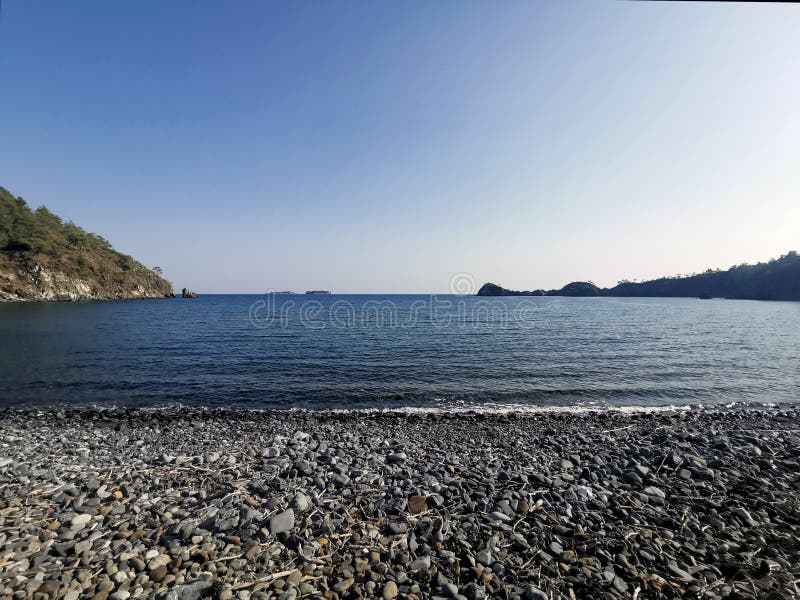 Pebble Beach without People in a Bay in the Mediterranean Sea Stock ...
