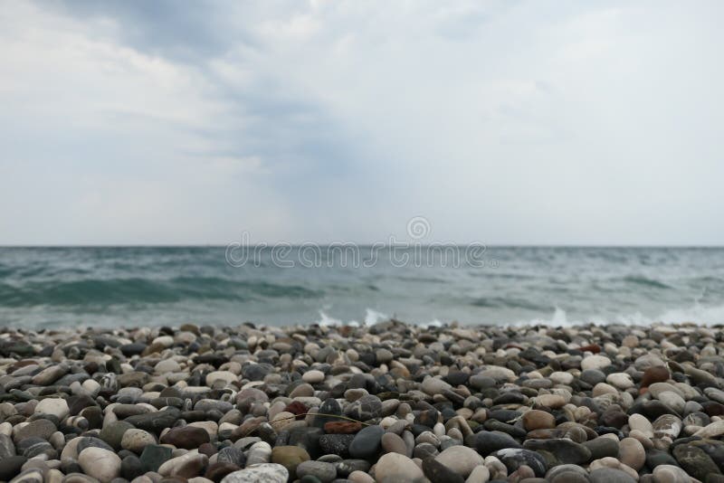 Pebble beach stock photo. Image of clouds, scenic, coastline - 155401208
