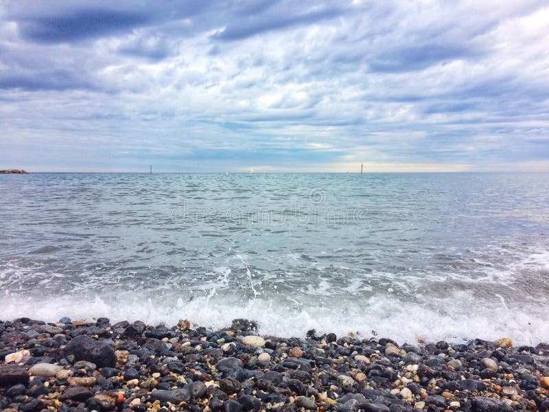 Pebble Beach on Stormy Weather. Stock Image - Image of travel, rocks ...