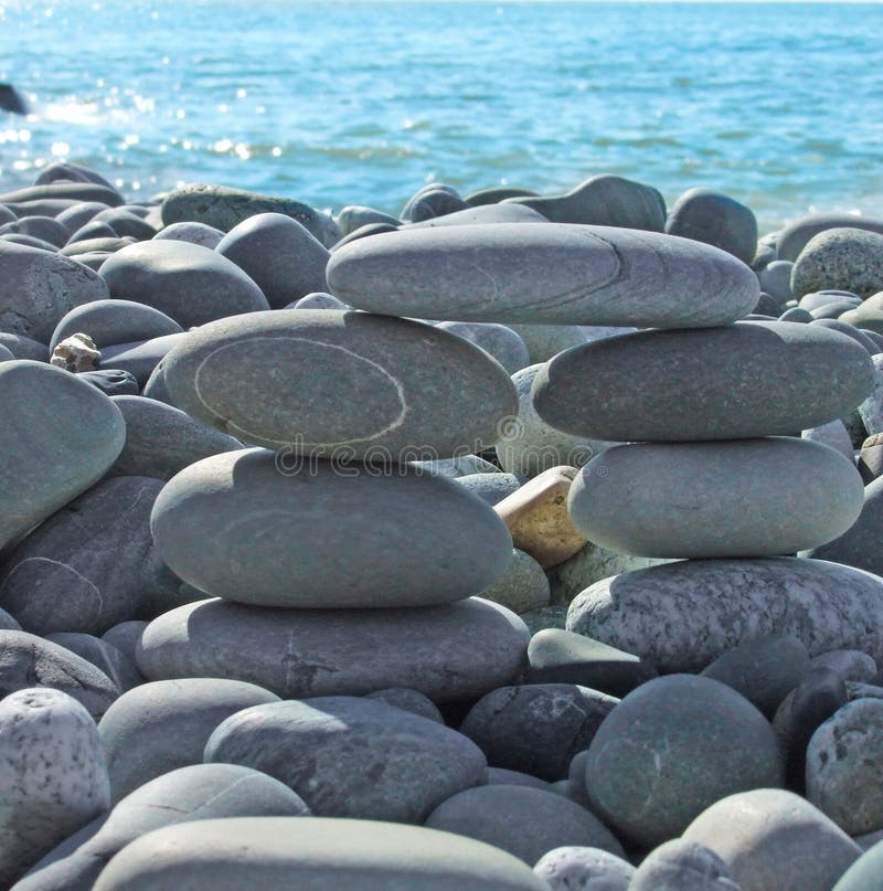 Mound of the Balanced River Pebbles and Hot Red Pepper on the Sandy ...