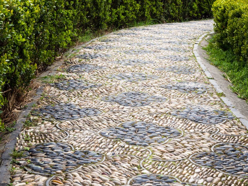 Pebble path in a garden stock photo. Image of china, design - 87482840