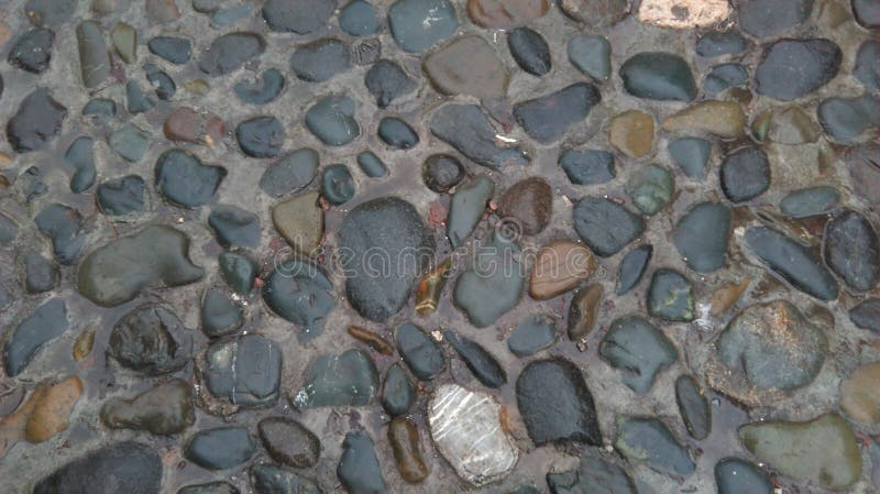 Pebble road in city stock photo. Image of circle, asphalt - 358458098