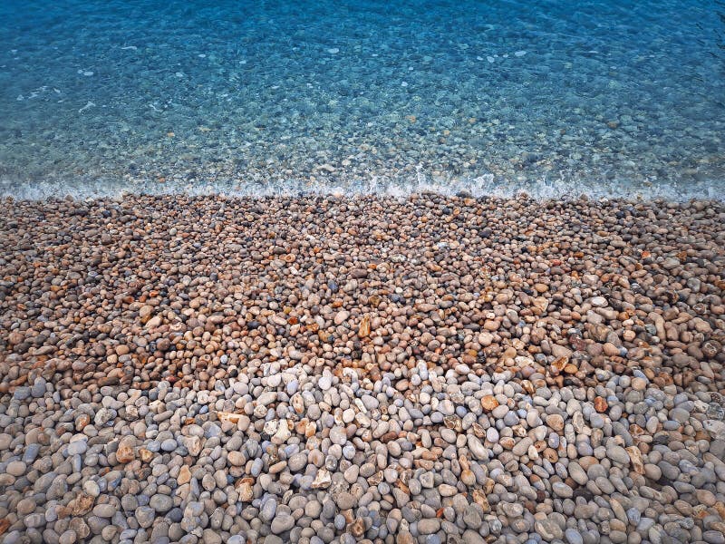 Pebble Rocks Beach and Blue Sea Water Texture Stock Photo - Image of ...