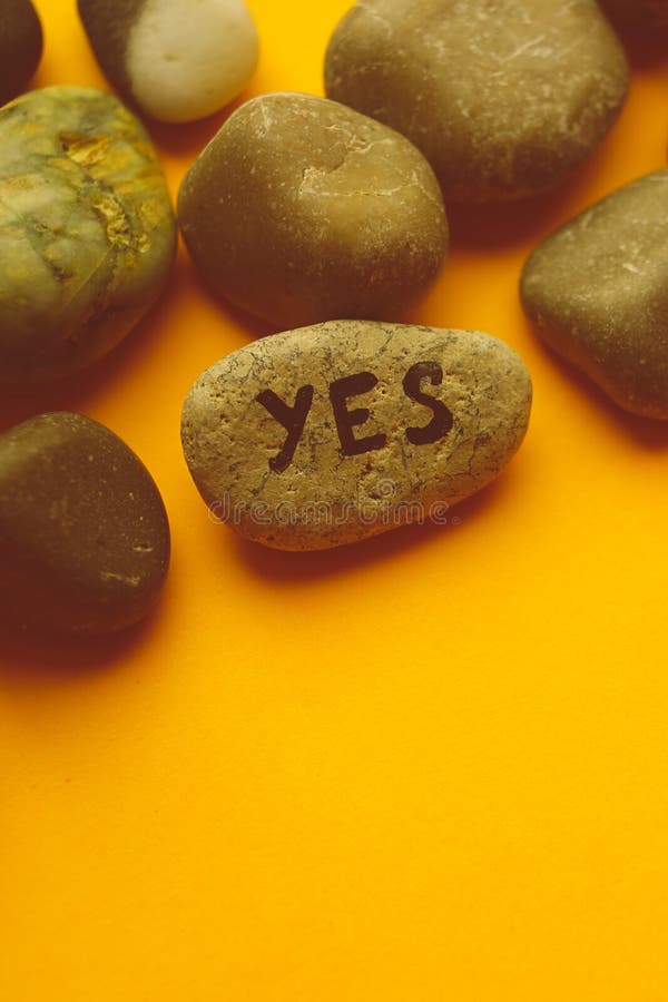 Pebble Stone with the Text Yes on an Orange Table in a Heap of P Stock ...