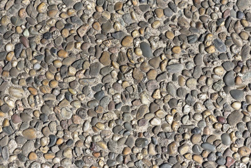 Pebble Stone Wall Texture. Finishing the Foundation of the House with ...