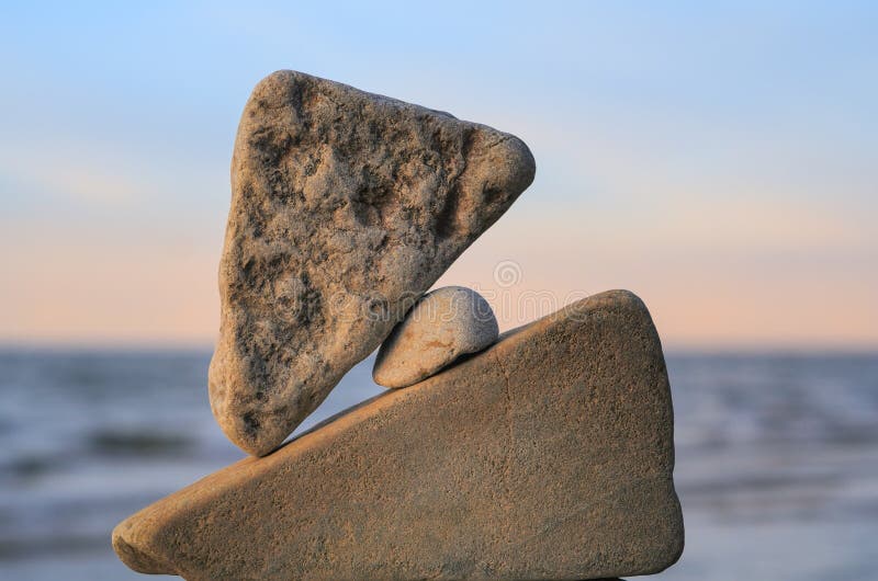 Pebble between two stones stock image. Image of accuracy - 63199667