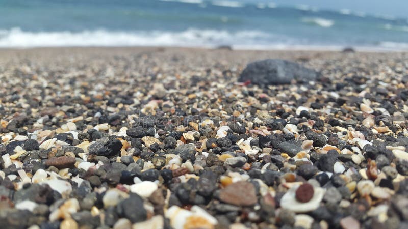 Pebbles on beach stock image. Image of daytime, stones - 83016071