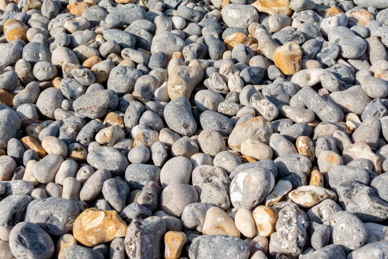 Pebbles on a beach stock image. Image of texture, nature - 258300985