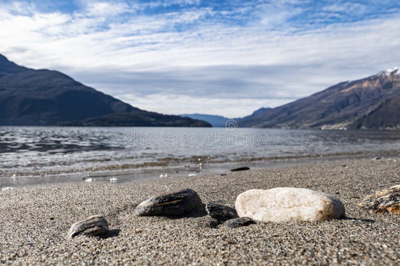 Pebbles on a Beach of Lake Como Stock Image - Image of morning, como ...
