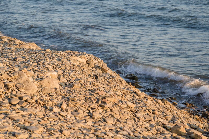 Pebbles on the Beach Pebbles on the Sea Shore and Waves of Water ...