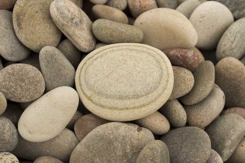 Pebbles on the beach stock image. Image of concentric - 76959215