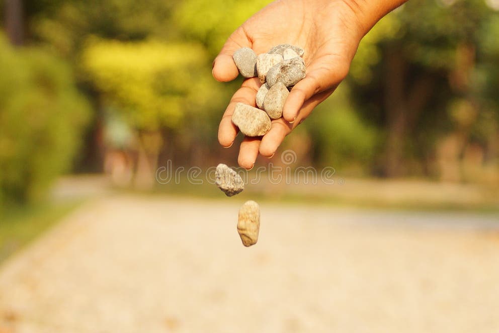 Pebbles stock image. Image of pebbles, hand, falling - 64678177
