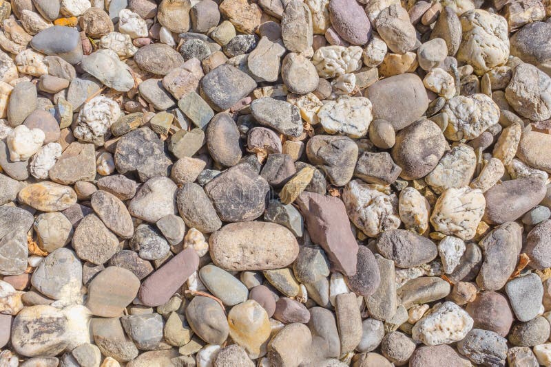 Pebbles on the ground stock photo. Image of design, material - 138421000