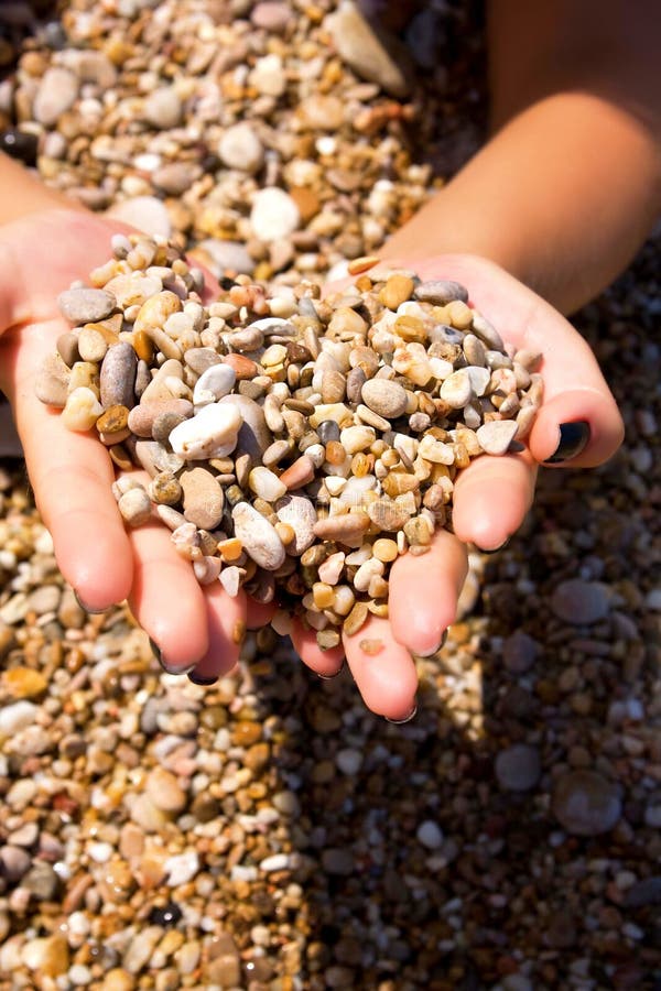 Pebbles in hands stock photo. Image of natural, beauty - 21971796