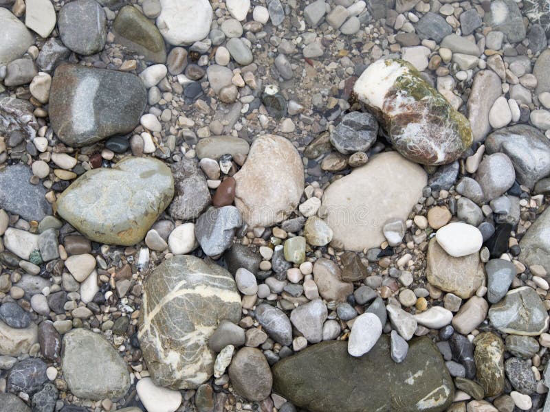 Pebbles on the river bank stock photo. Image of river - 90380316