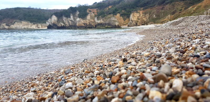 Pebbles among the Sand on Seashore Stock Photo - Image of close, calm ...
