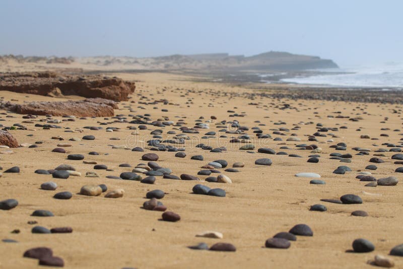 Pebbles on a Sandy Beach by the Ocean Stock Photo - Image of surf, site ...