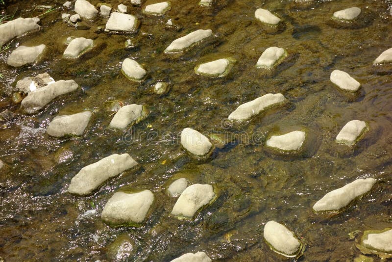 Pebbles Scattered on the Water Surface Stock Photo - Image of medium ...