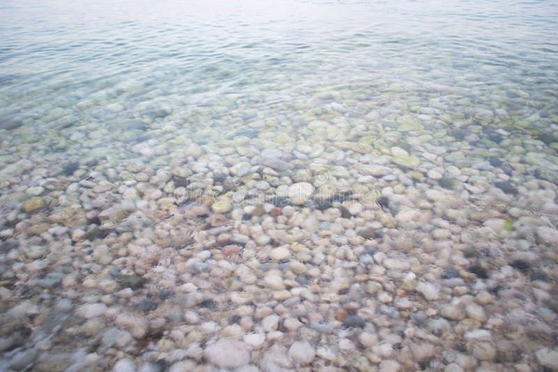 Pebbles on the seashore stock image. Image of solitude - 32848741