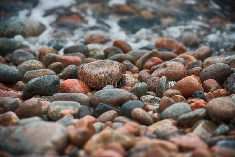 Pebbles at shore stock photo. Image of sunset, landscape - 95723960
