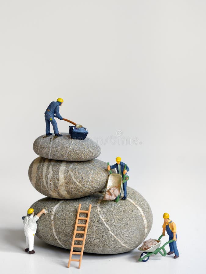 Pebbles Stack and Figurines of Construction Stock Image - Image of ...