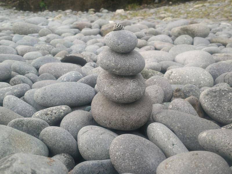 There is a Four-stone Stacked Tower Stock Image - Image of stones, soil ...