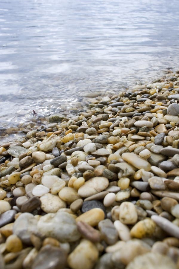 Pebble beach stock image. Image of shore, landscape, mountain - 12930455