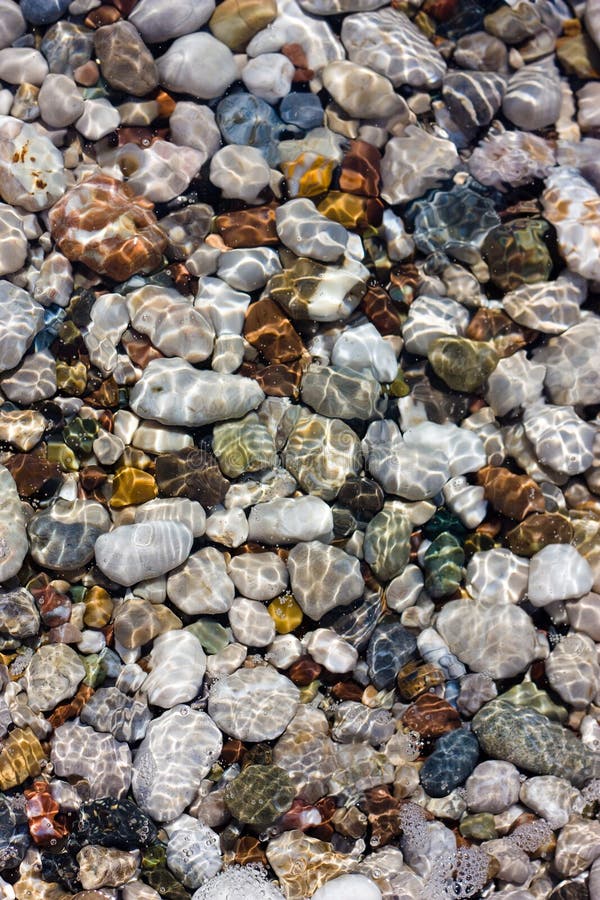 Pebbles and water stock photo. Image of closeup, ocean - 22381266