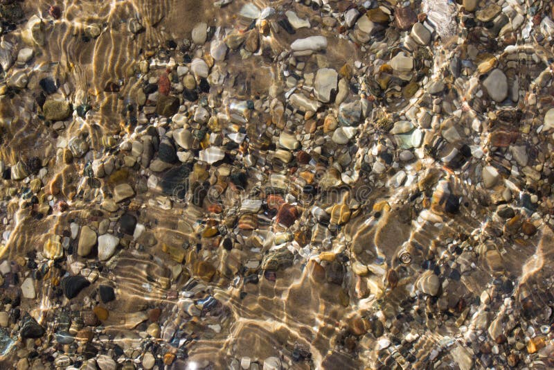 Pebbles in Water stock photo. Image of pebbles, rock - 28044904