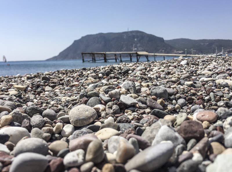 A pebbly beach in Greece stock image. Image of island - 86658175