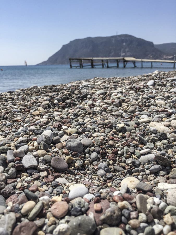 A pebbly beach stock image. Image of ocean, tide, blue - 86658101