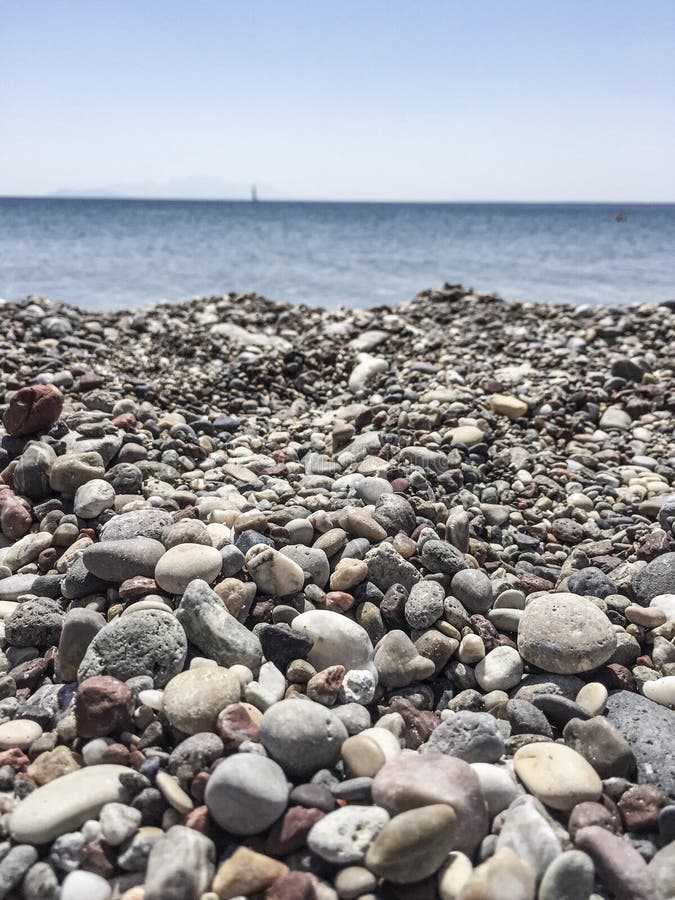 Hat on a pebbly beach stock photo. Image of stone, island - 86658024
