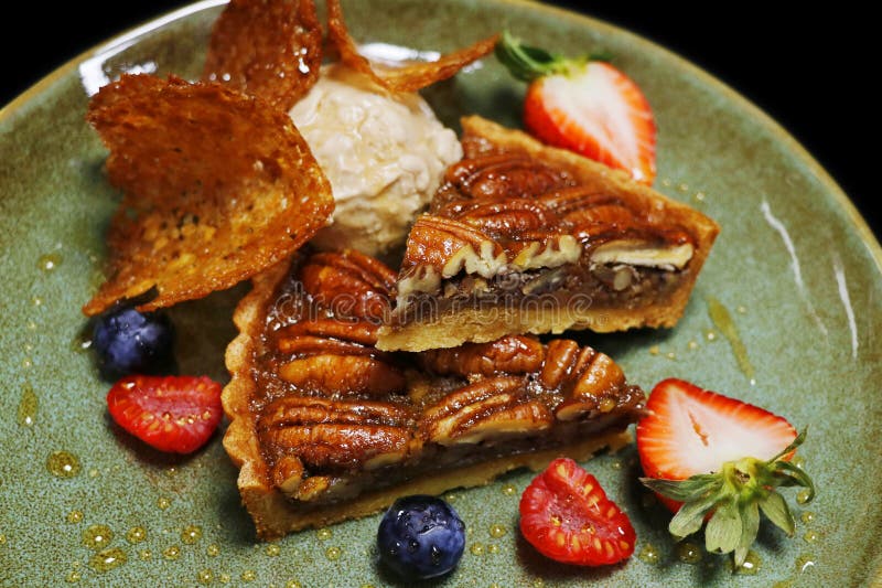 Pecan Nut Tart with Vanilla Ice Cream and Fresh Assorted Berries Stock ...