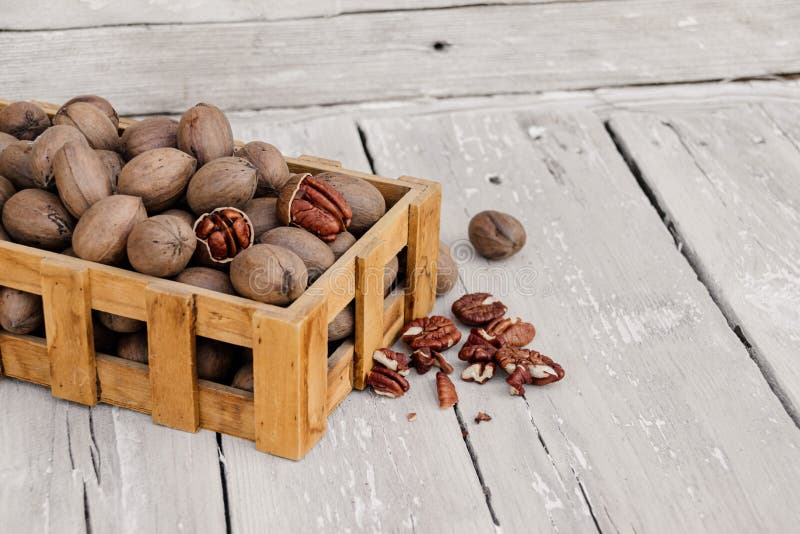 Pecan Nuts in Crate on White Wood Stock Photo - Image of crate ...