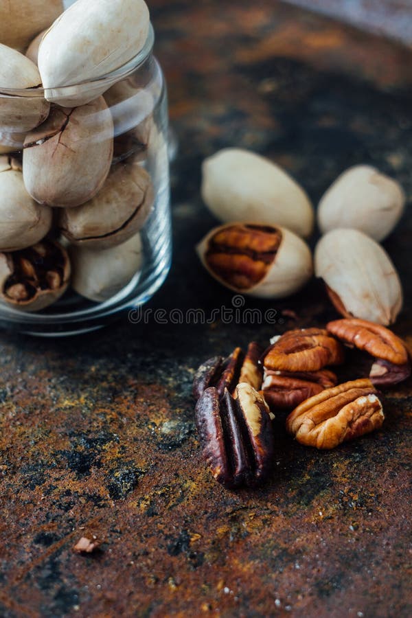 Pecan Nuts Inside Glass Jar on Rustic Surface. Stock Photo - Image of ...
