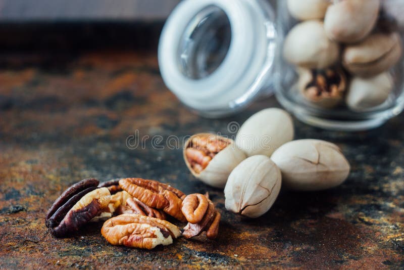 Pecan Nuts Inside Glass Jar on Rustic Surface. Stock Photo - Image of ...