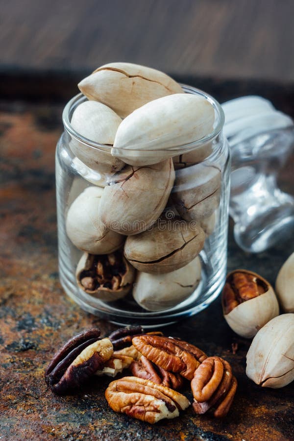 Pecan Nuts Inside Glass Jar on Rustic Surface. Stock Photo - Image of ...