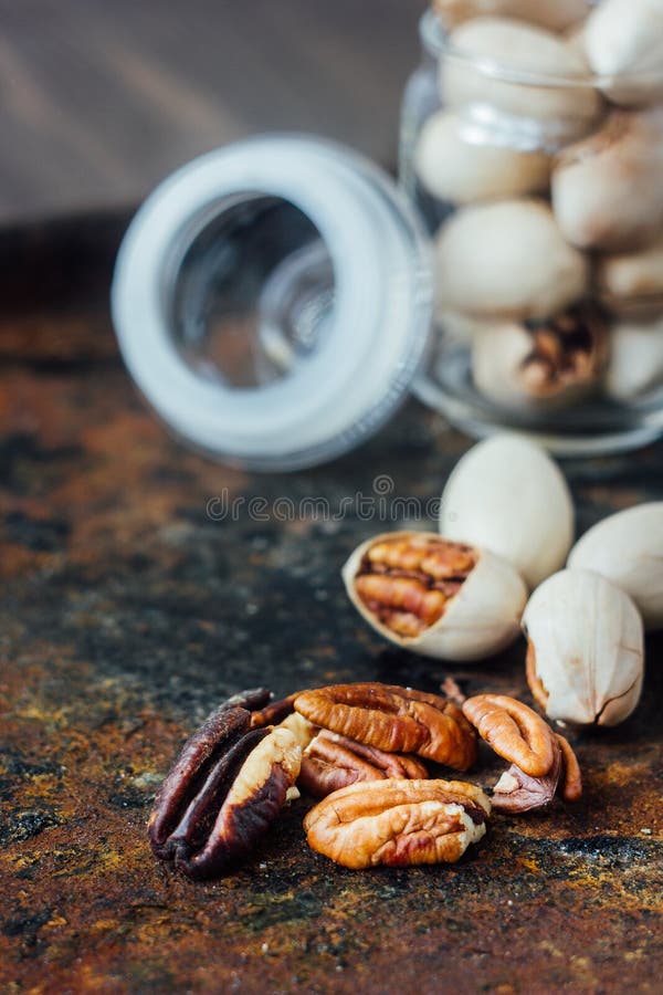 Pecan Nuts Inside Glass Jar on Rustic Surface. Stock Image - Image of ...