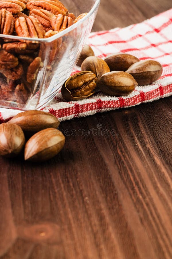 Pecan Nuts in the Shell with Pecan Kernel on Wooden Background Stock ...