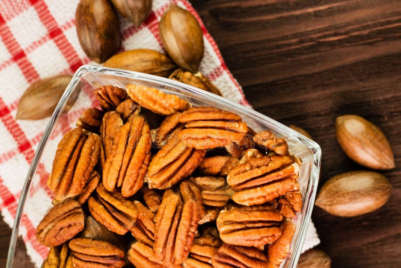 Pecan Nuts in the Shell with Pecan Kernel on Wooden Background Stock ...