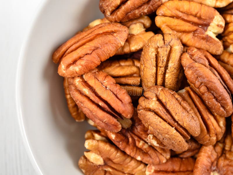 Pecan Nuts in White Bowl stock photo. Image of tasty - 84535164