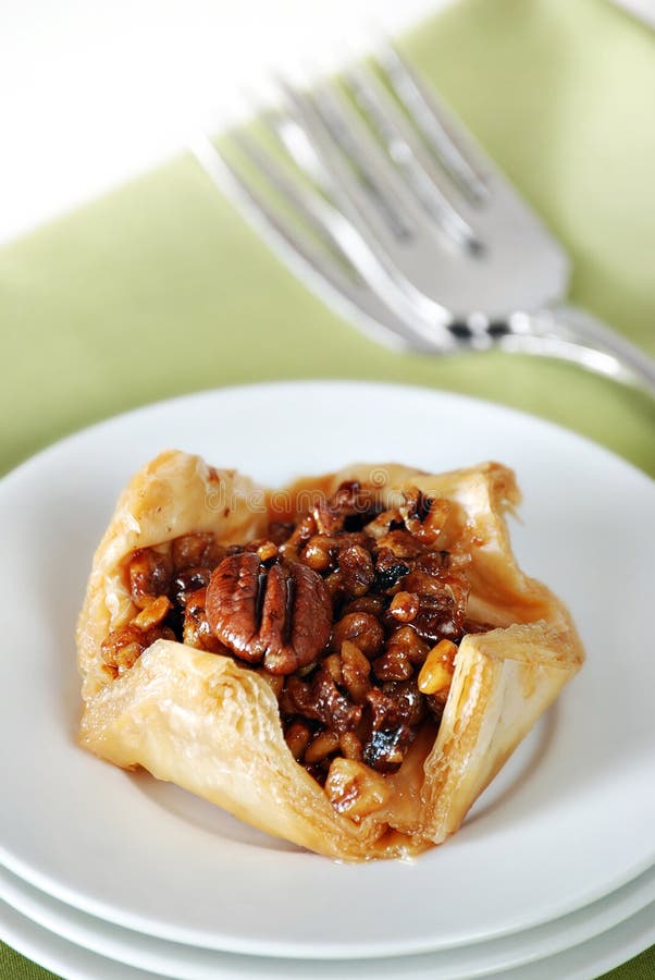 Pecan Puff Pastry on White Plates Stock Image - Image of pastry, plates ...