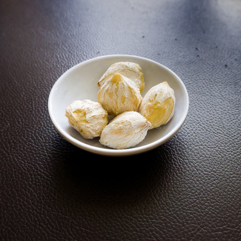 Candlenuts Stacked in a Bowl Stock Image - Image of bowl, food: 275114653