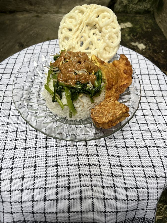 Pecel Rice with Vegetables and Side Dishes Topped with Peanut Sauce ...
