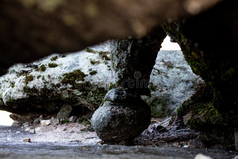 Peculiar Rock Formation Underneath a Boulder Stock Image - Image of ...