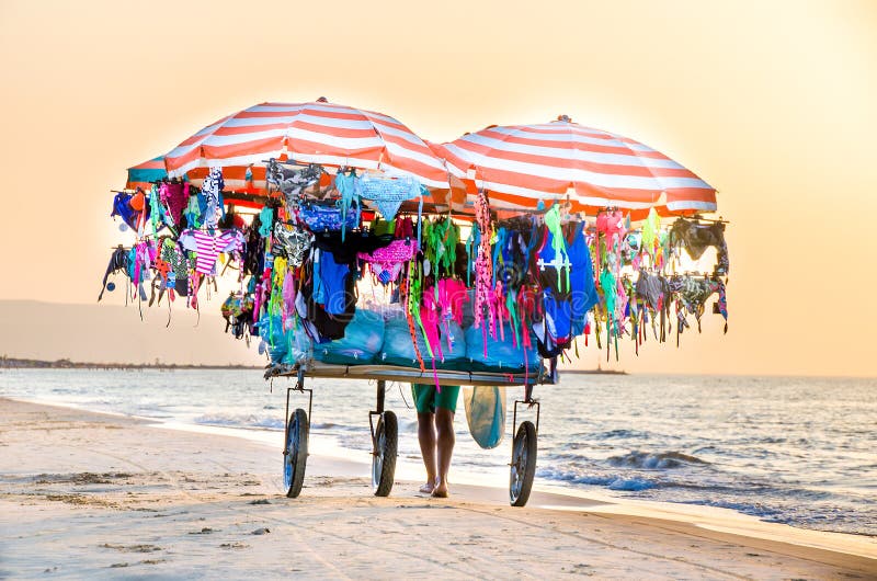 Peddler on beach in Italy stock image. Image of peddler - 65266205
