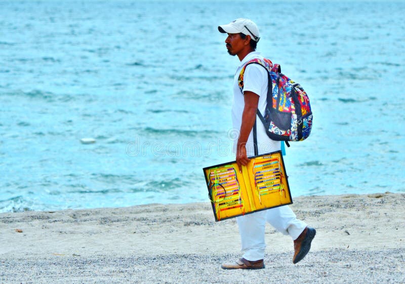 Peddler at the beach editorial photography. Image of incomer - 47088347