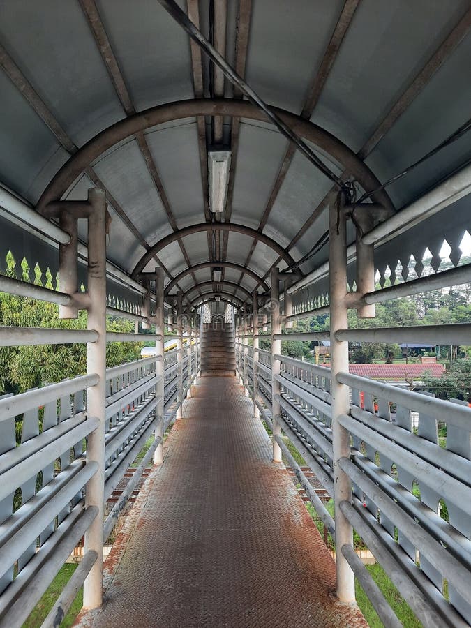 A Pedestrian Bridge Over the Railroad Tracks Stock Photo - Image of ...